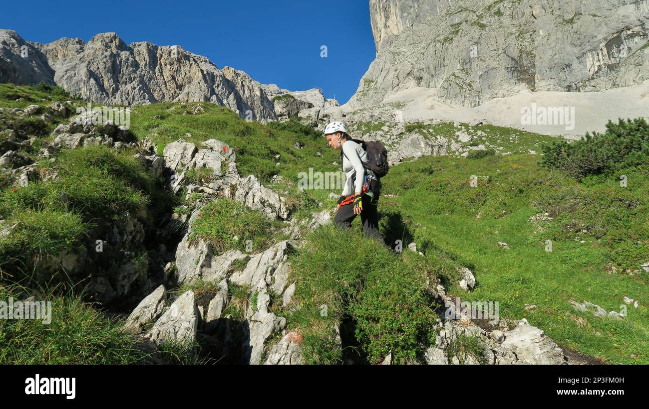 Tourist with equipment on a mountain trail in the Alps. Zugspitze ...