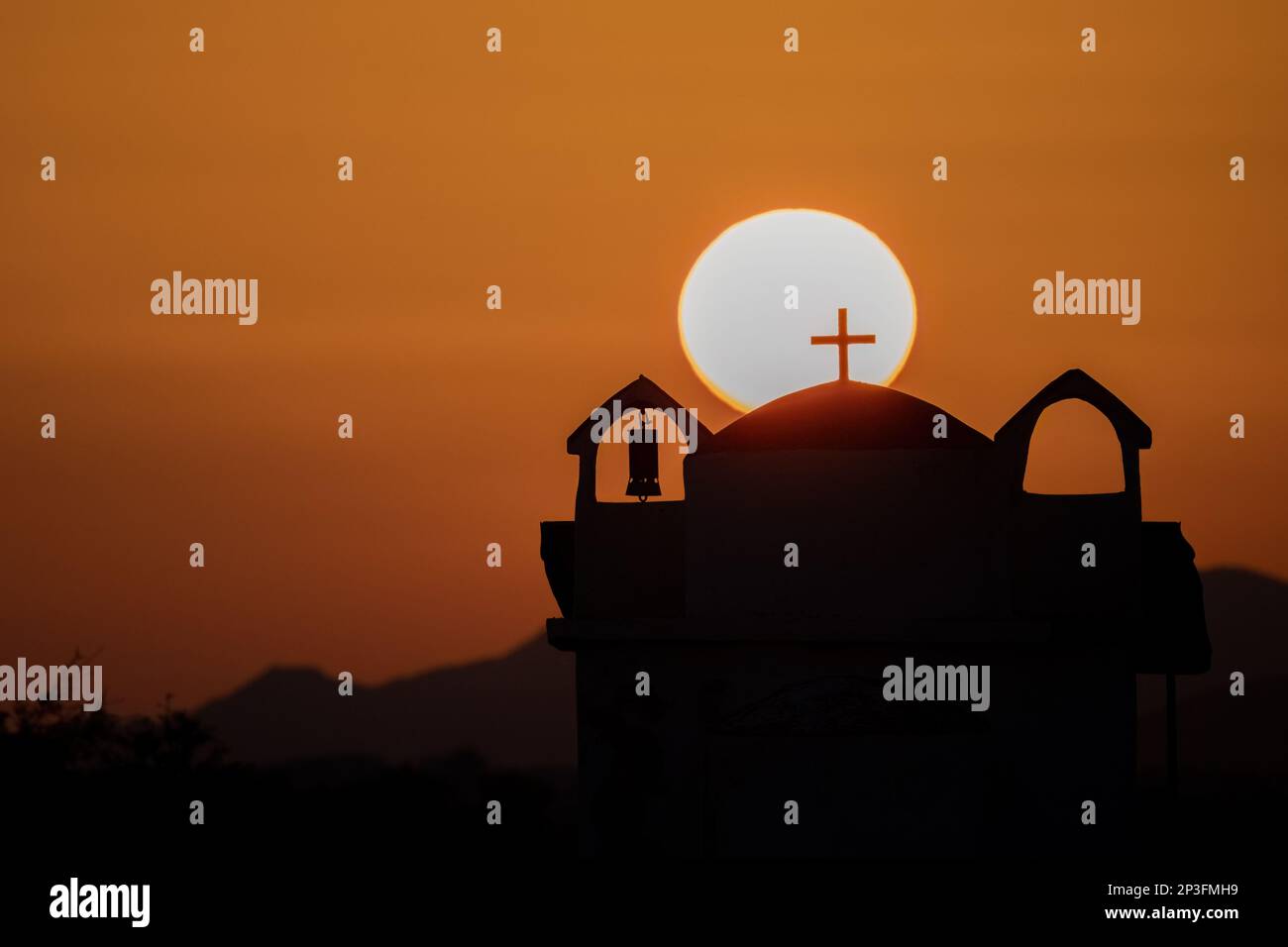 Beautiful sunset colors with a dark church silhouette Stock Photo - Alamy
