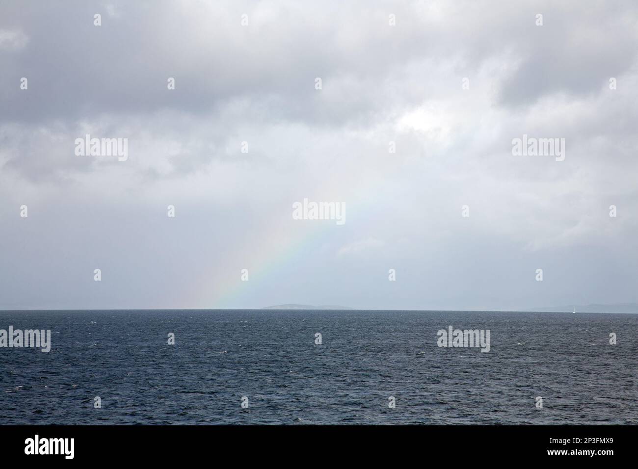 Rainbow The Forth of Clyde viewed from the ferry Caledonian Isles travelling between Brodick on ...
