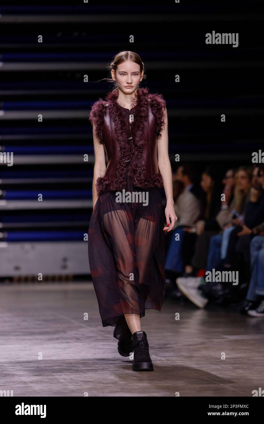 A model wears a creation as part of the Akris Fall/Winter 2023-2024 ...