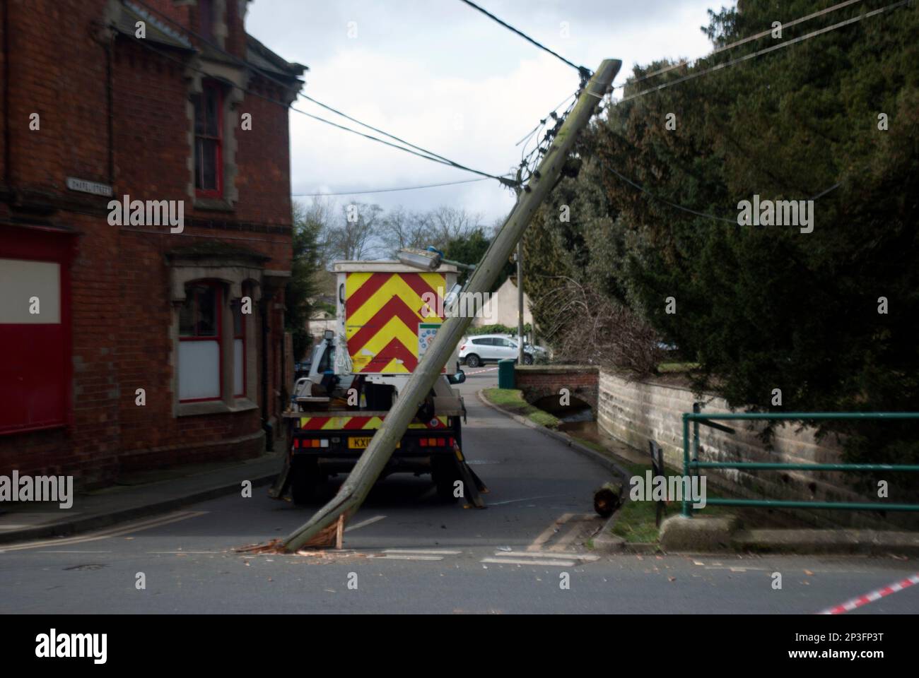 Damaged and broken telegraph poll in the village of Ruskington Stock ...