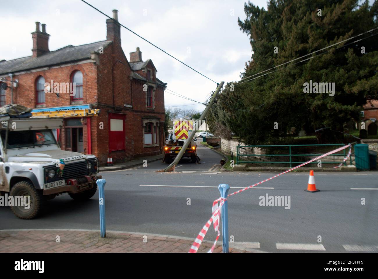 Damaged and broken telegraph poll in the village of Ruskington Stock ...