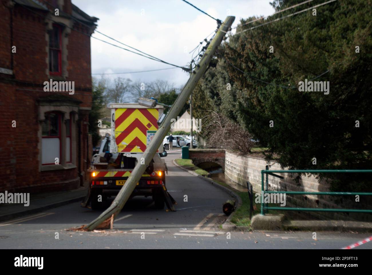 Damaged and broken telegraph poll in the village of Ruskington Stock ...