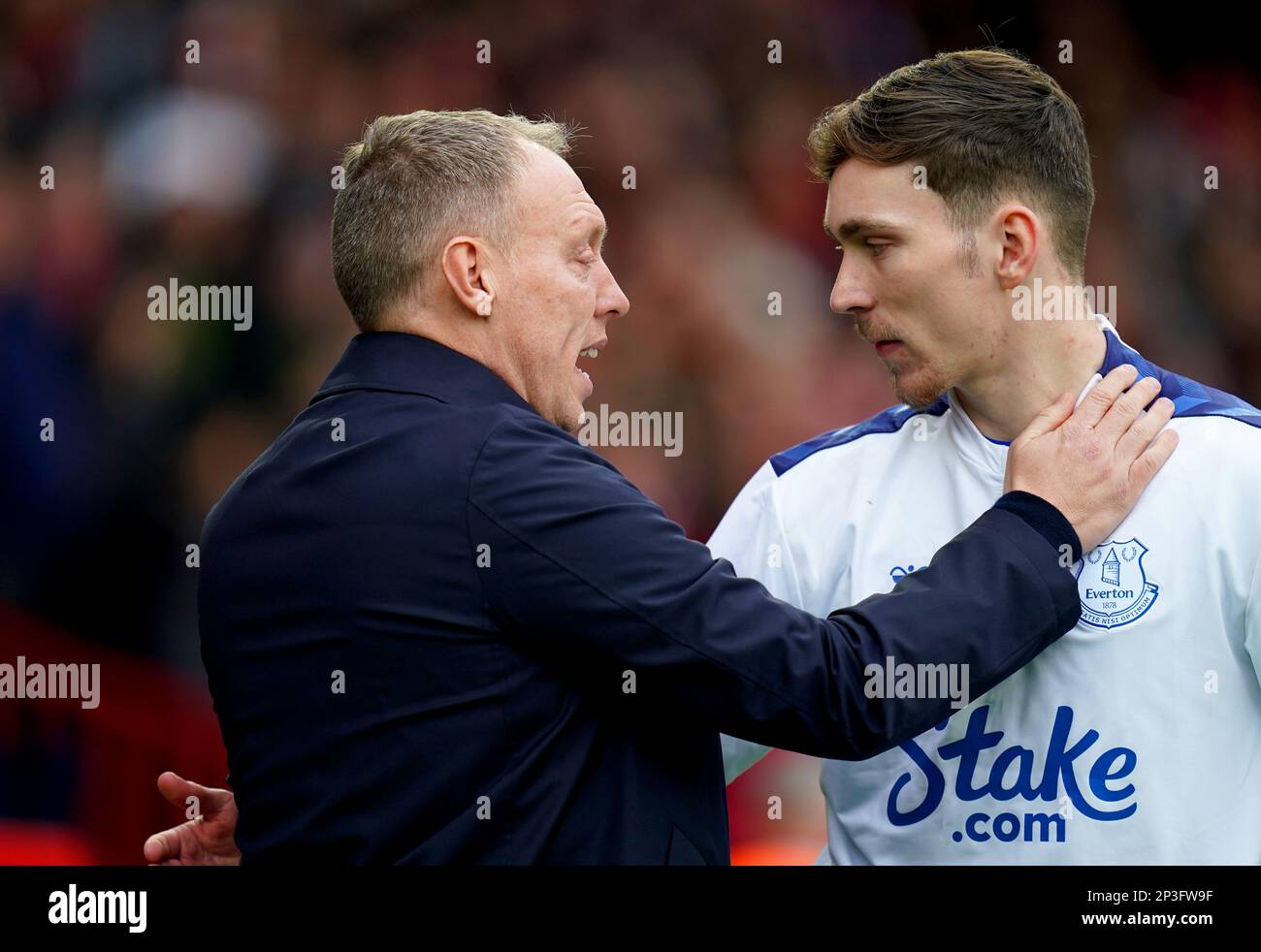 Nottingham Forest manager Steve Cooper (left) speaks to Everton's James ...