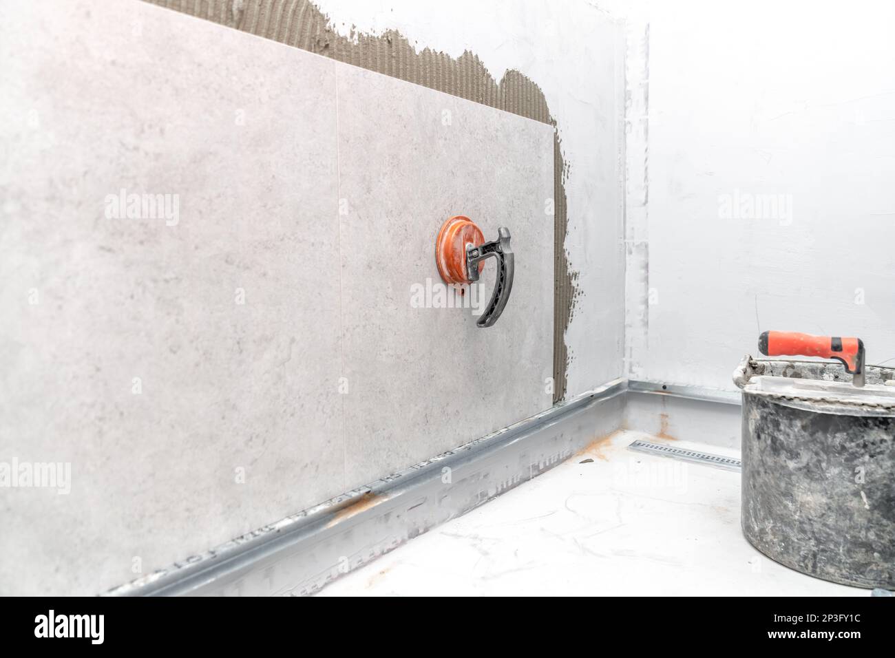 wall tiling with large-format ceramic tiles Stock Photo - Alamy