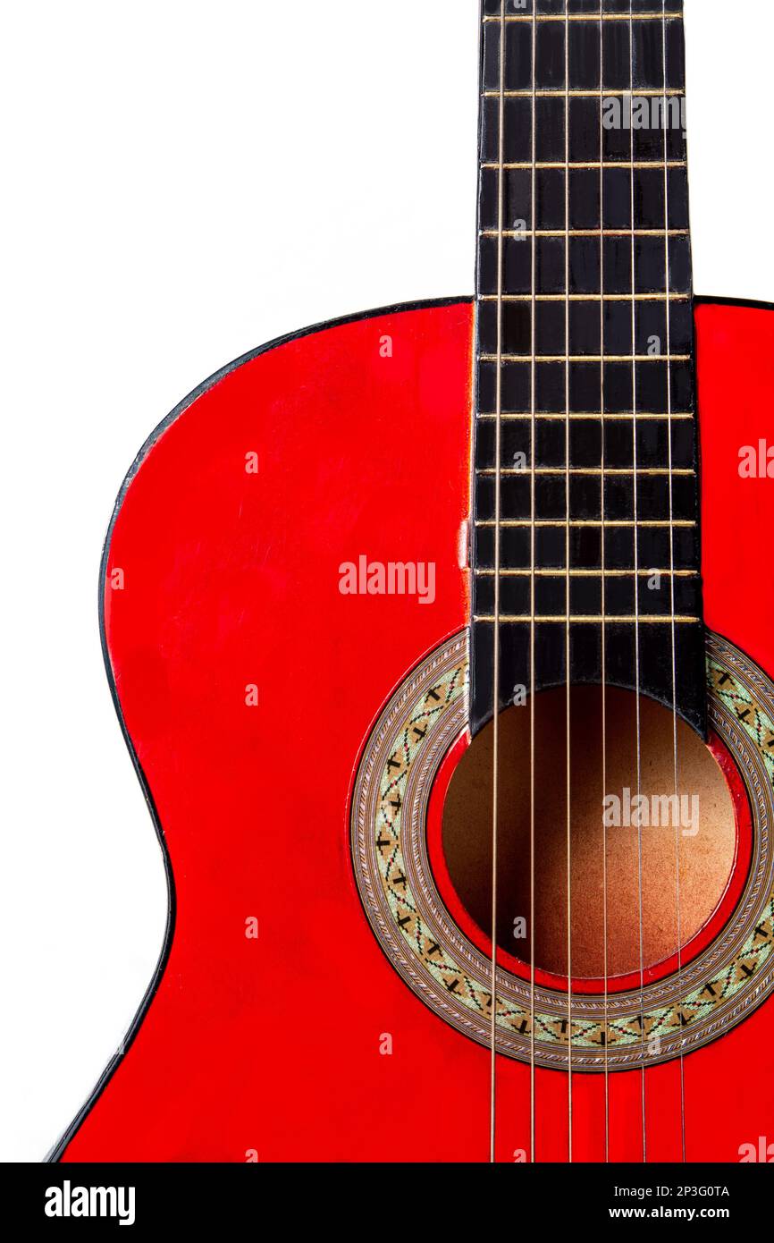 Close-up. A part of a red acoustic guitar A part of a red acoustic ...