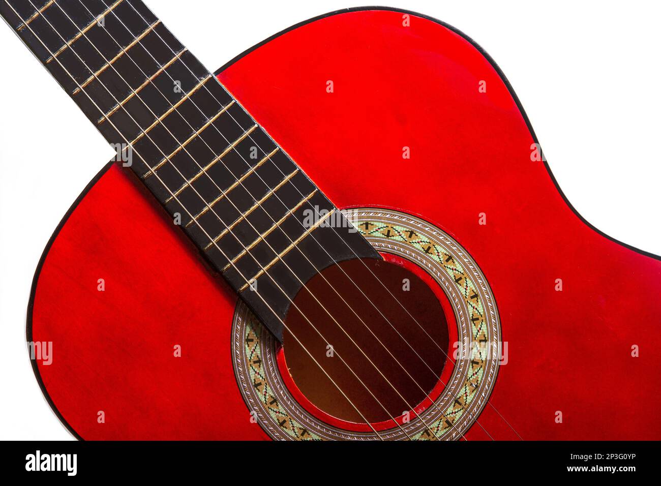 Close-up. A part of a red acoustic guitar A part of a red acoustic ...