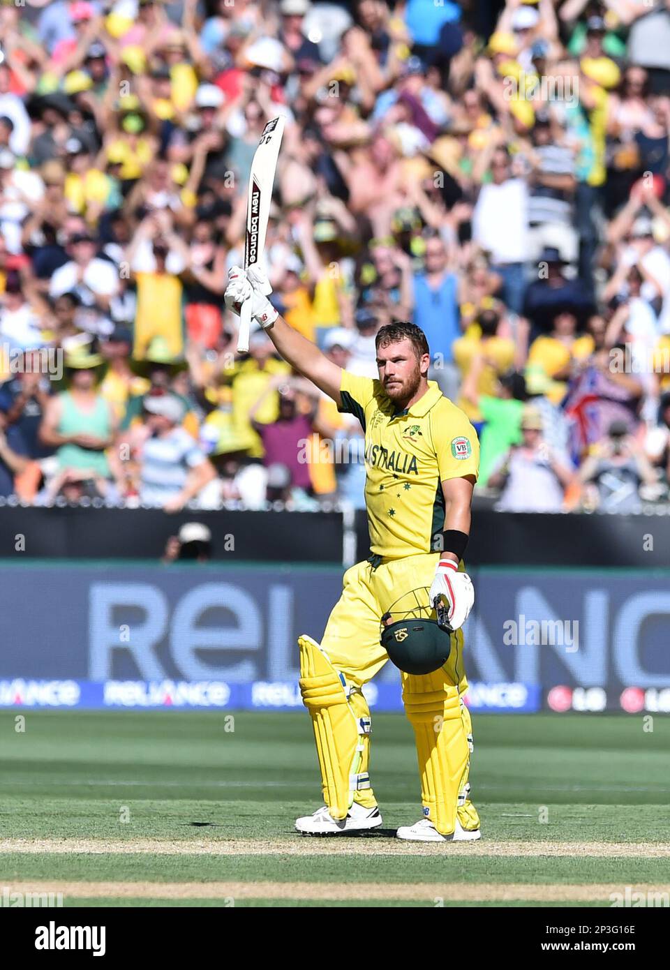 Australia's Aaron Finch raises his bat high as he celebrates hitting a ...