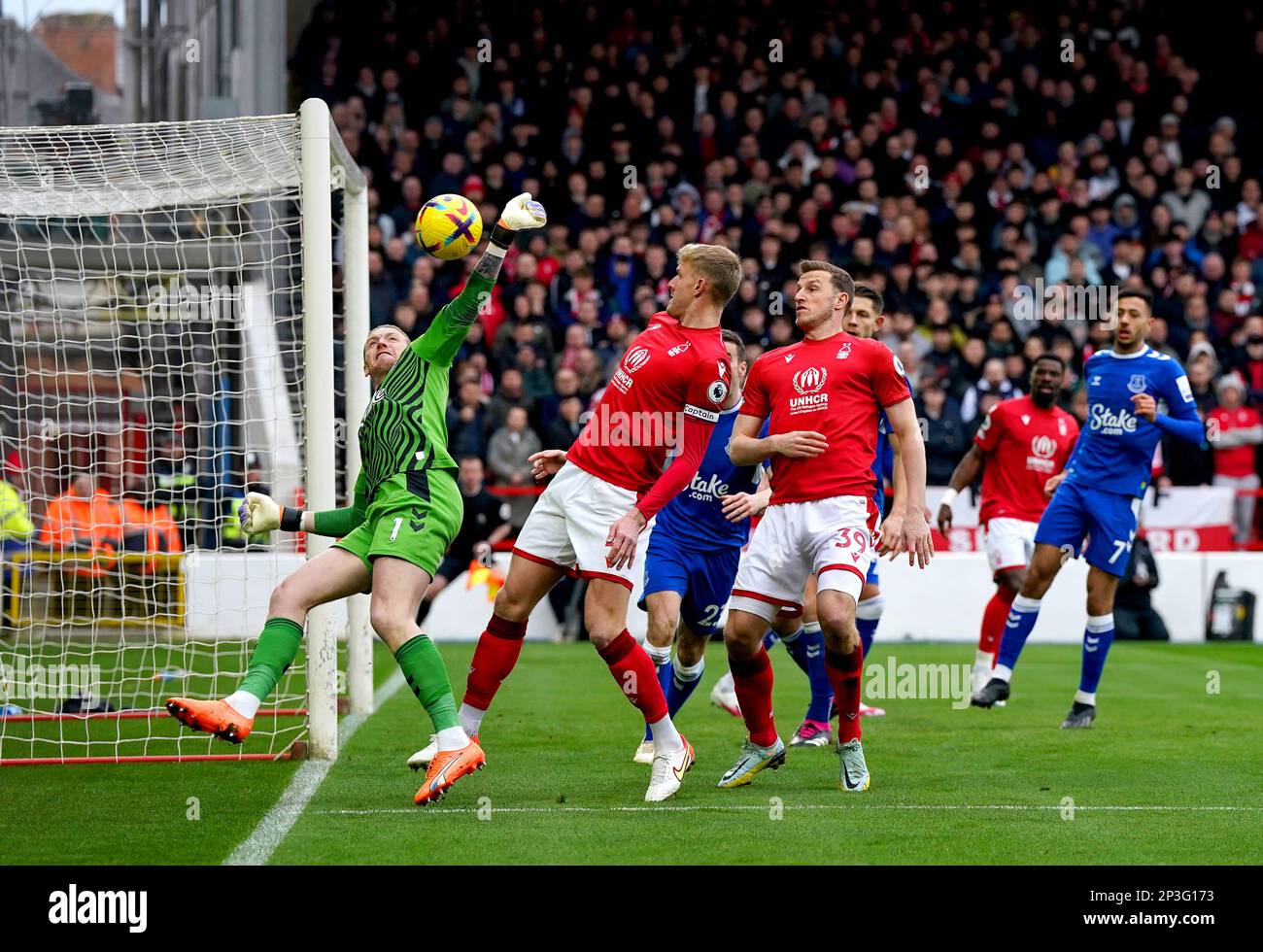 Everton goalkeeper Jordan Pickford punches the ball clear during the ...