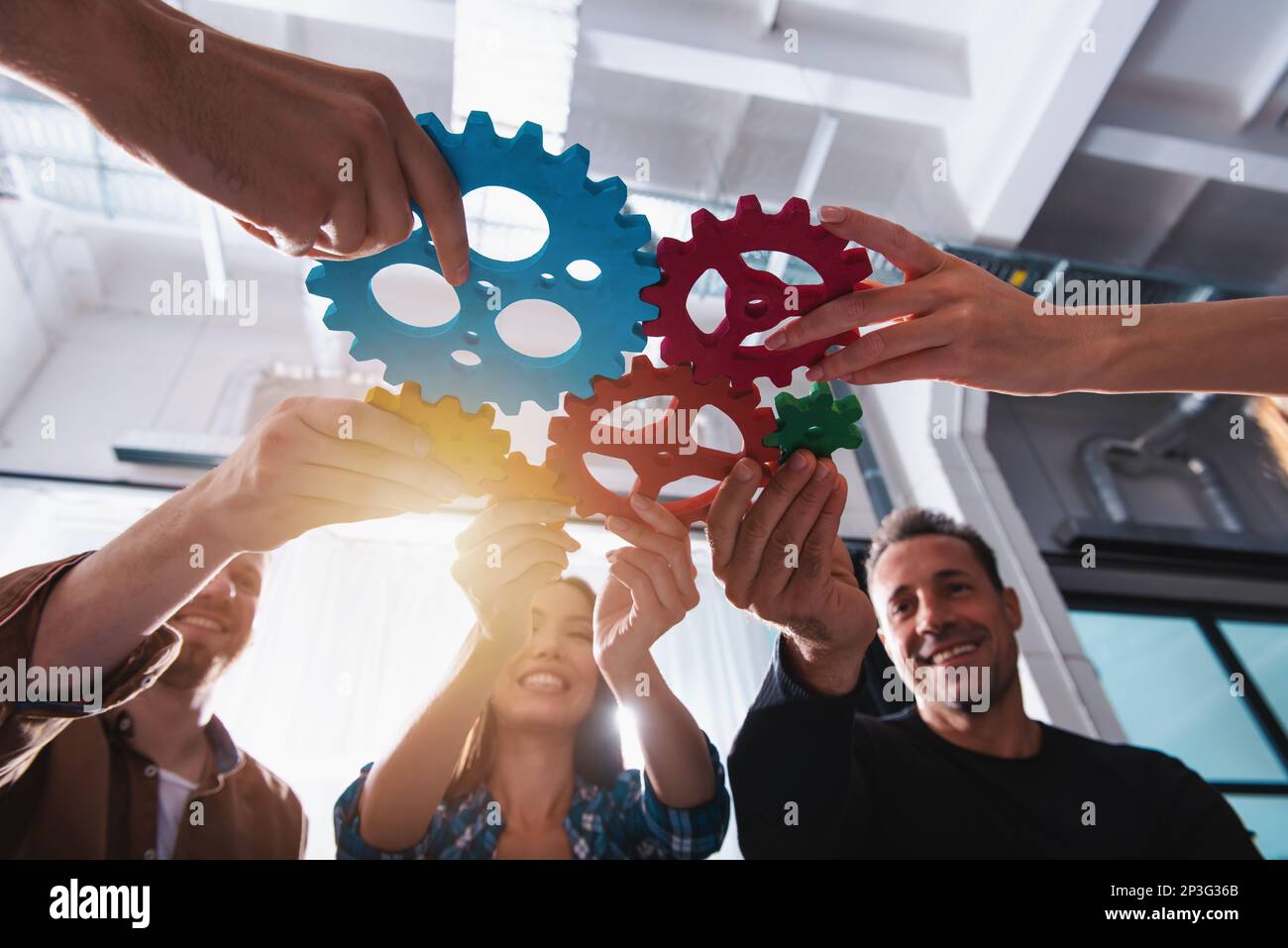 Business team connect pieces of gears. Teamwork, partnership and ...