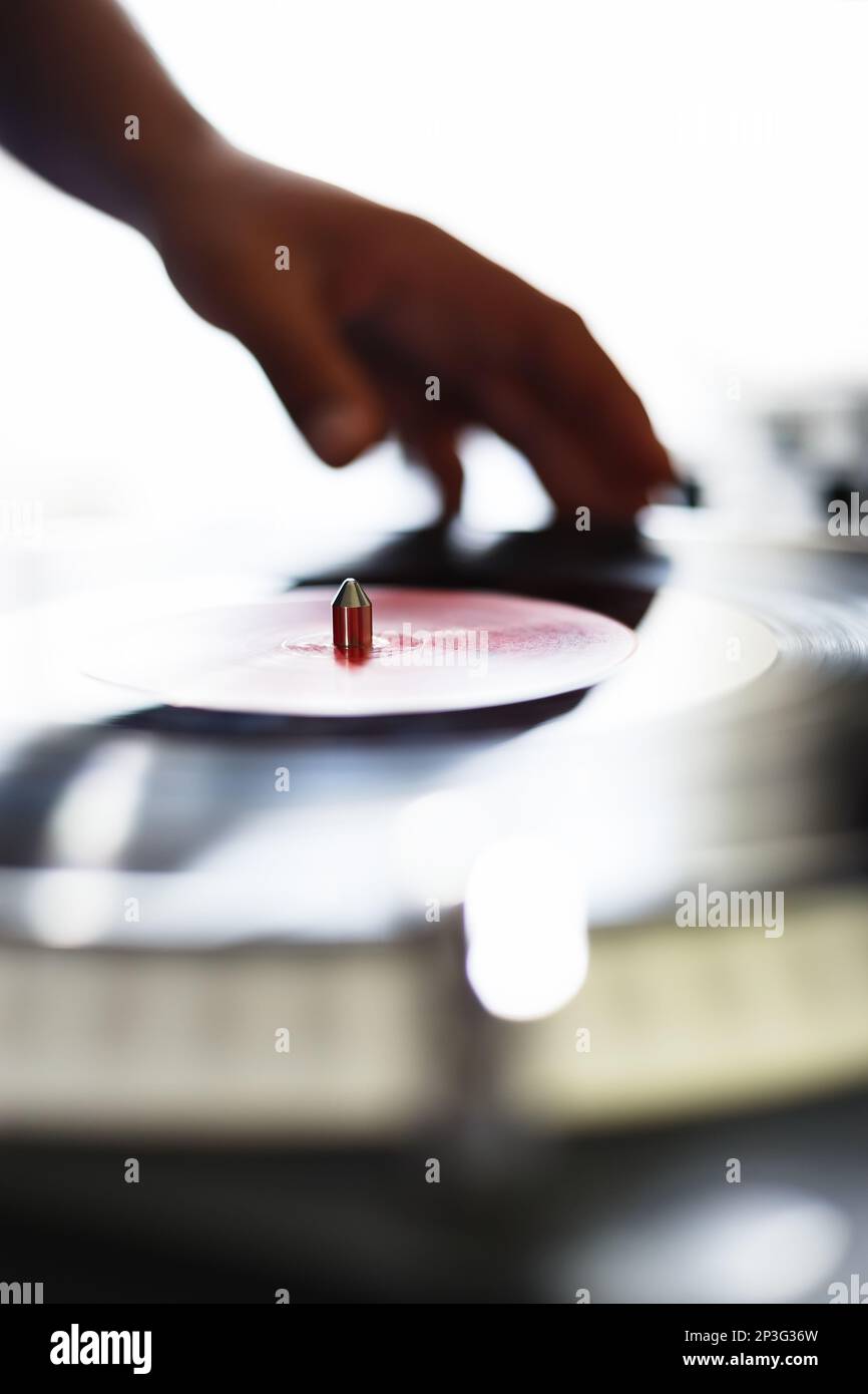 DJ mixing vinyl records on hip hop party. Close up photo of disc jockey ...