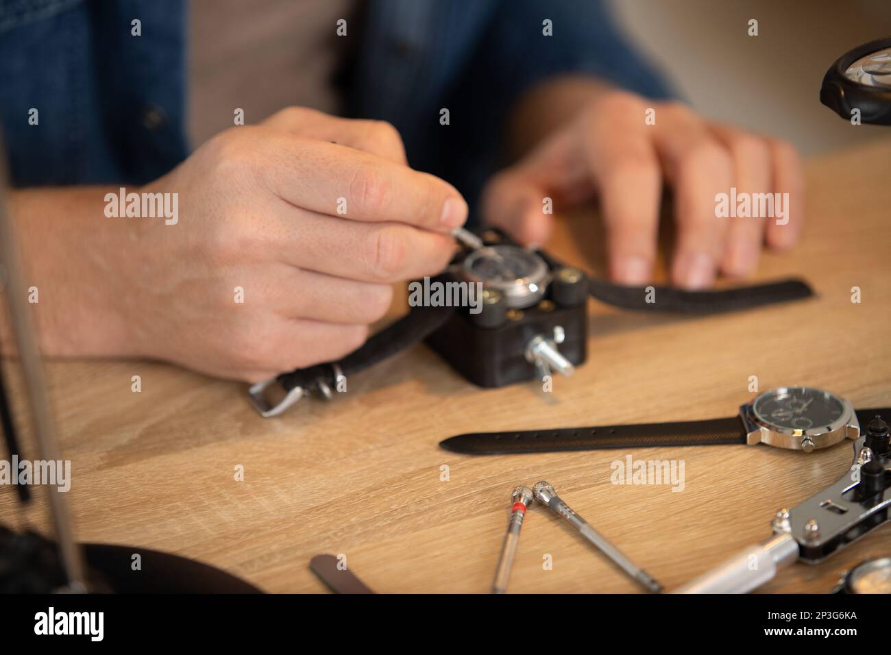 watchmaker try to repair watch with his tools Stock Photo - Alamy