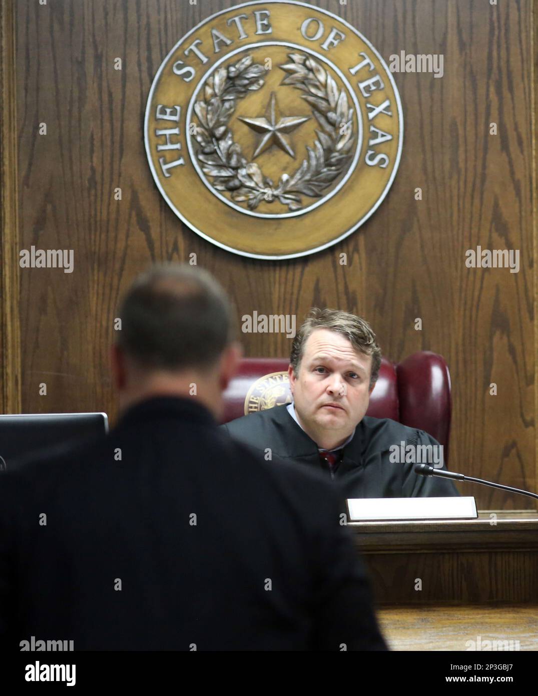 Judge Jason Cashon, right, listens to one of Eddie Ray Routh's lawyers ...