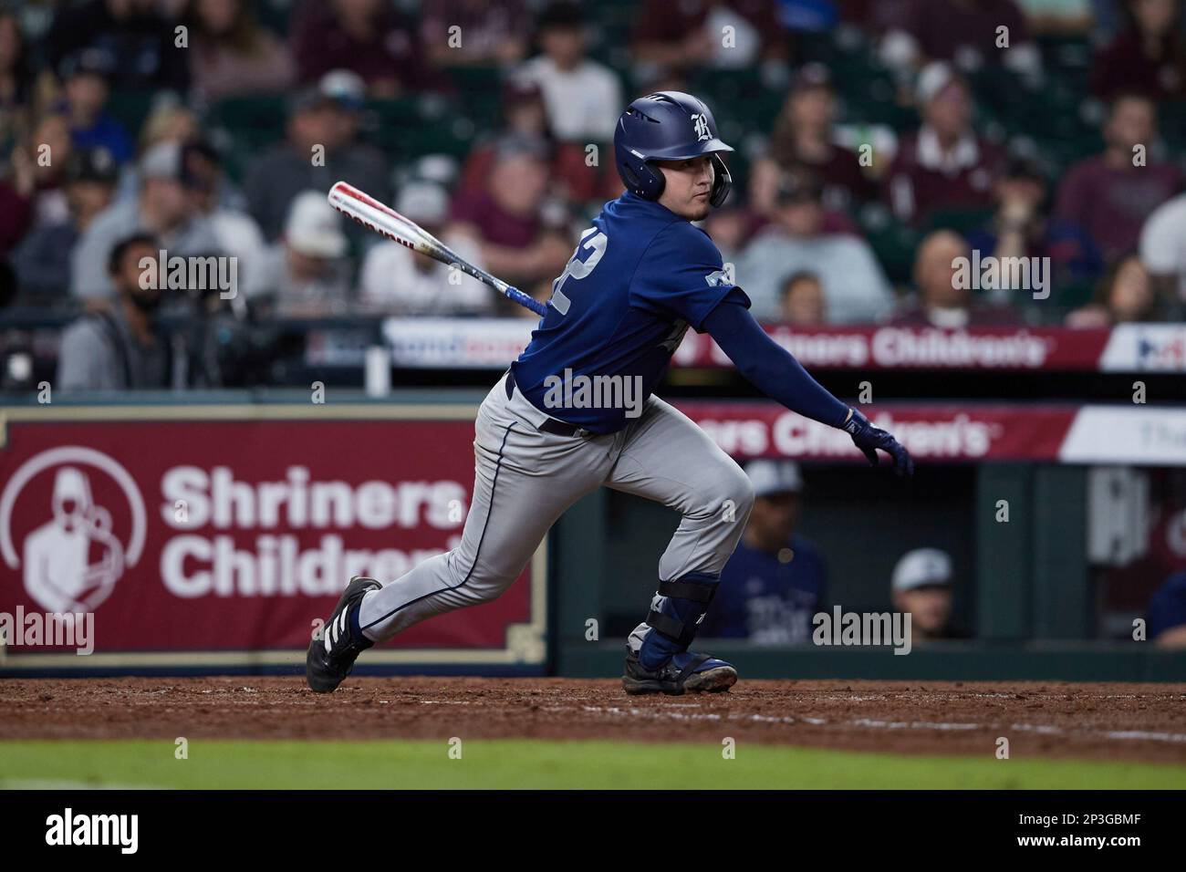Manny Garza (42) of the Rice Owls follows through on his swing against ...