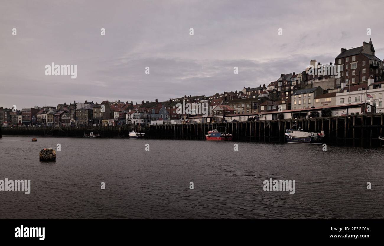 Fish-market with boats tied up from Tate Hill Pier harbour, Whitby ...