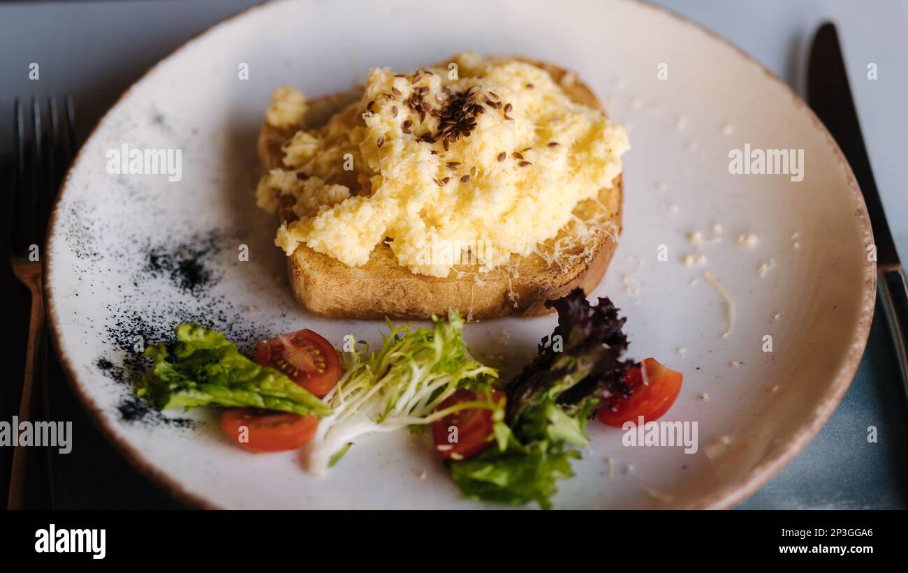 Delicious and beautiful breakfast. Toast with scramble on top ...