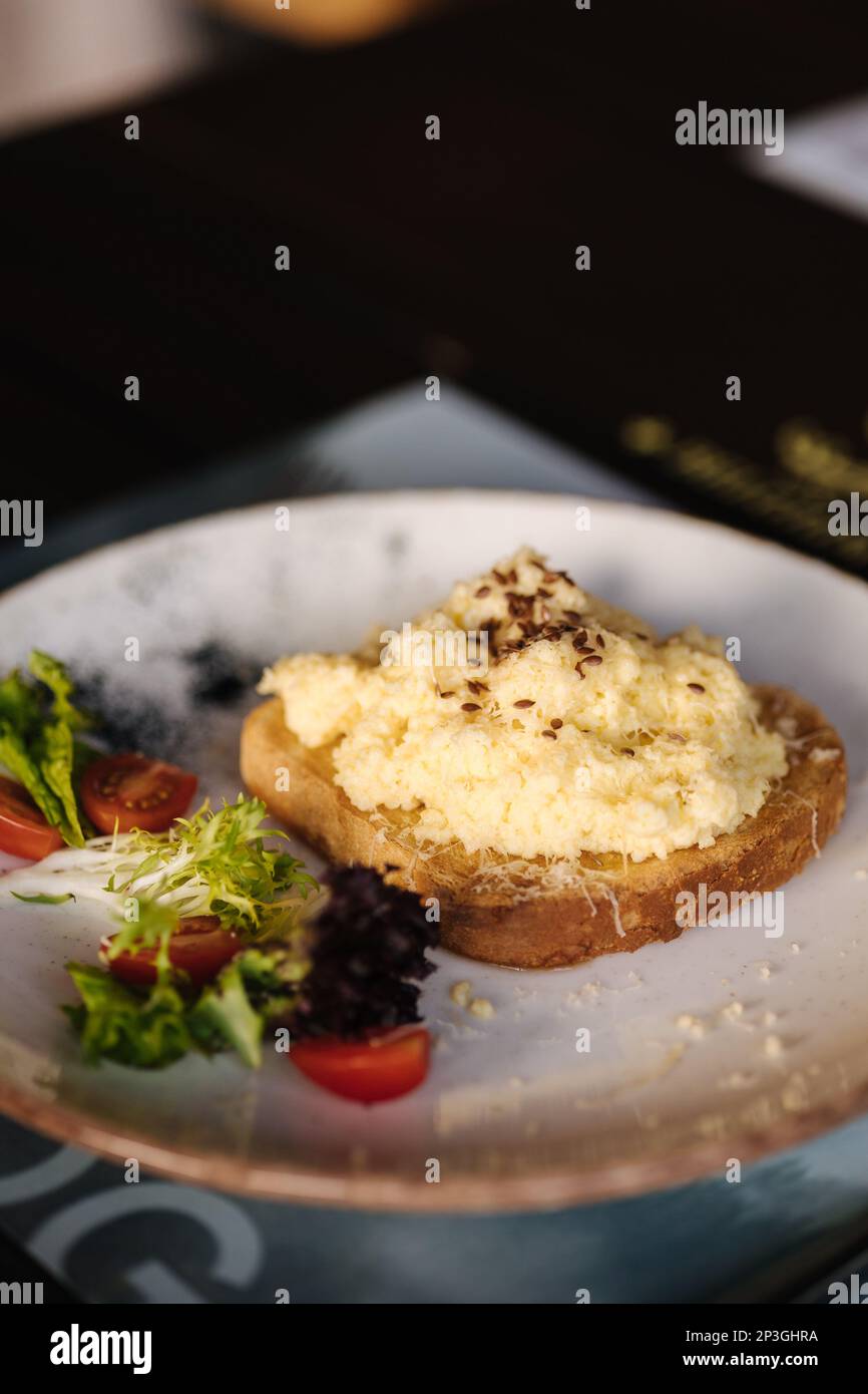 Delicious and beautiful breakfast. Toast with scramble on top ...