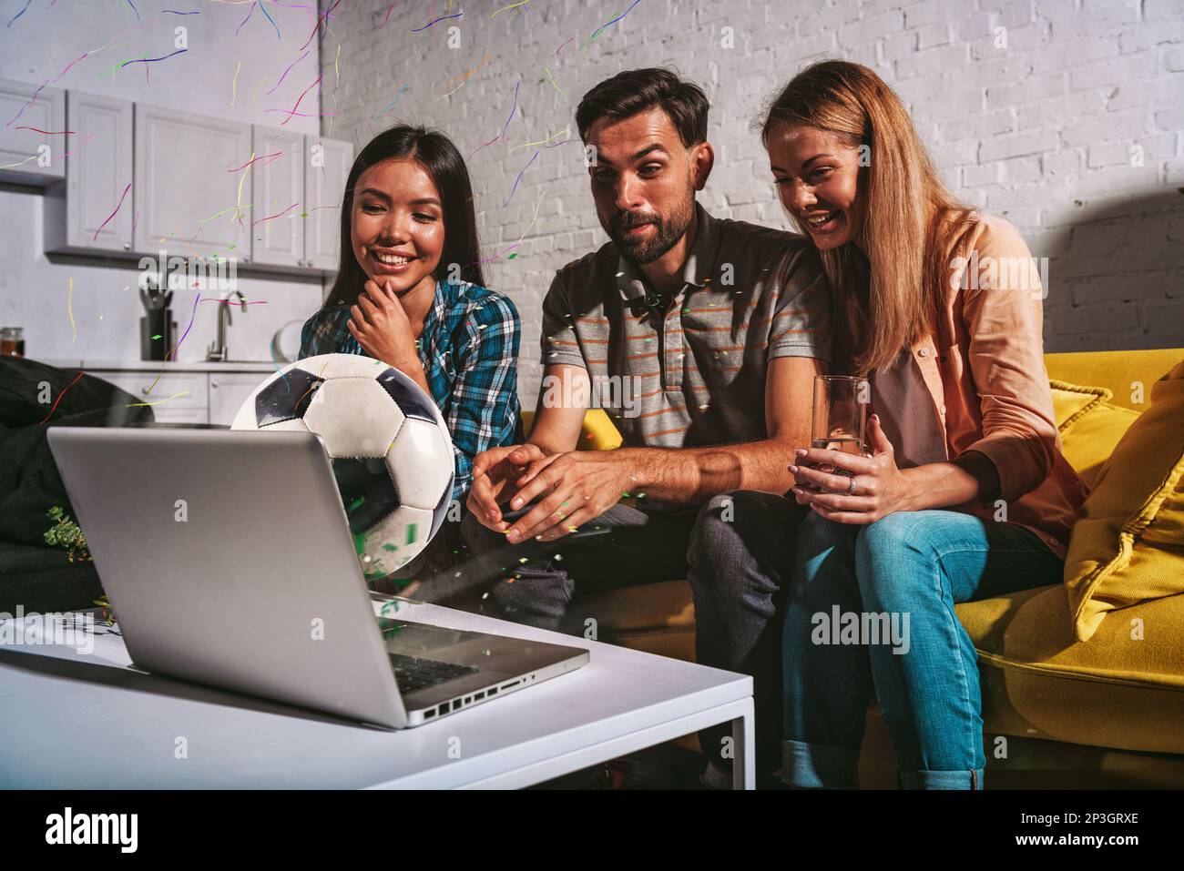 Football laptop fans watching hi-res stock photography and images - Alamy