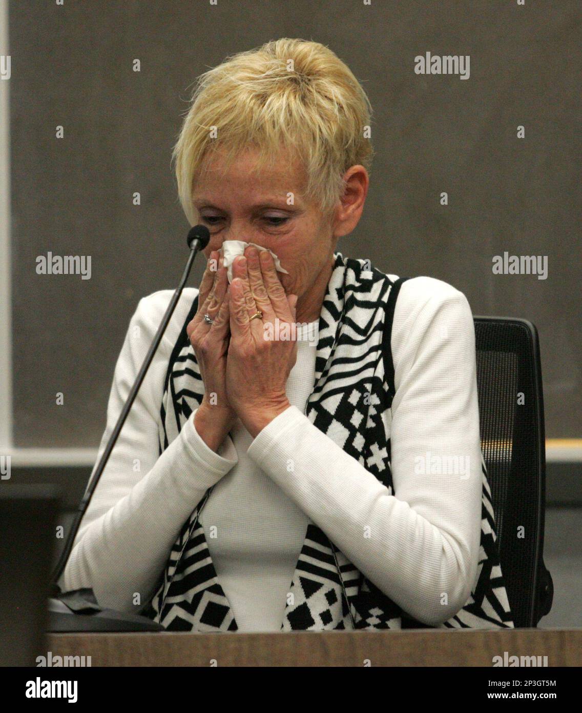 Rita Ham, of Newton, Iowa, uses a tissue as she testifies during ...