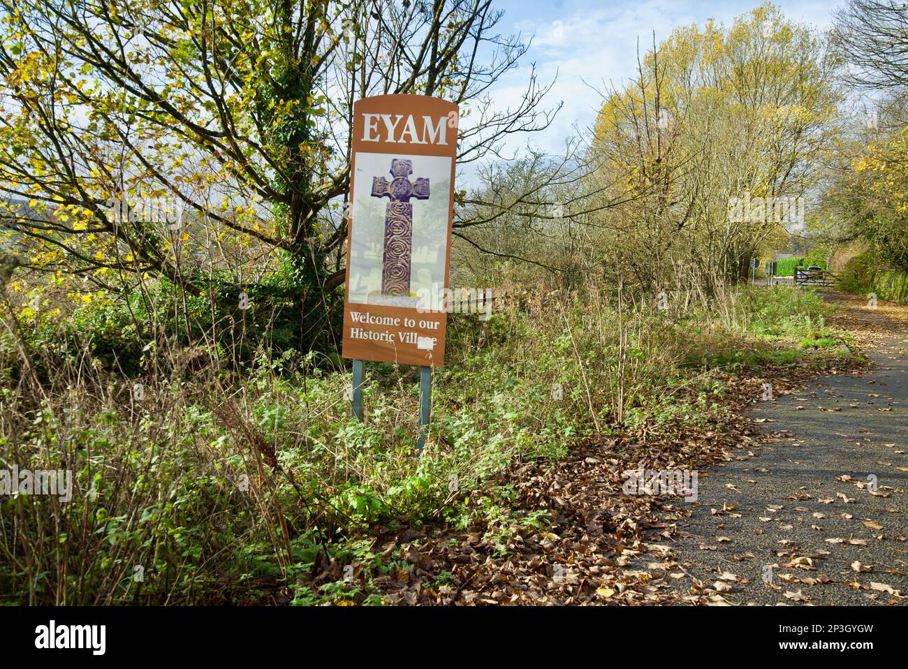 A sign for the village of Eyam reading "Eyam- Welcome to our Historic ...