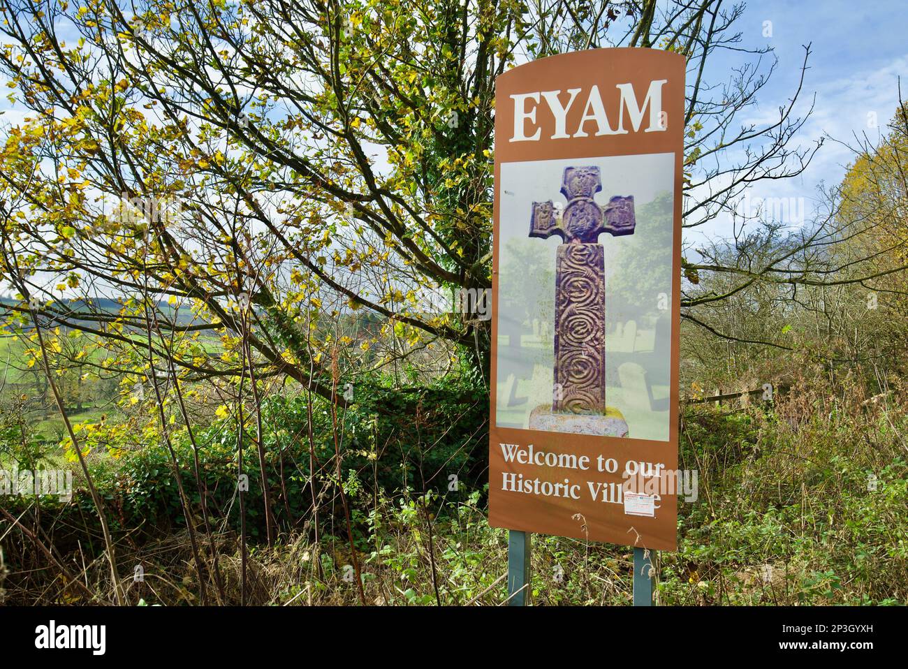 A sign for the village of Eyam reading "Eyam- Welcome to our Historic ...
