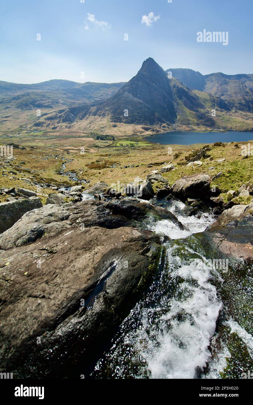 A stream running down towards Tryfan- a mountain in the Ogwen Valley ...