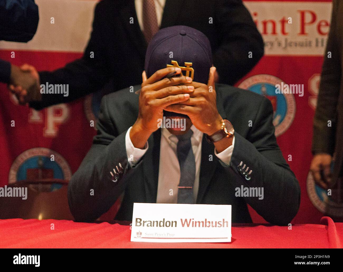 Brandon Wimbush puts his head down after signing his letter on intent ...