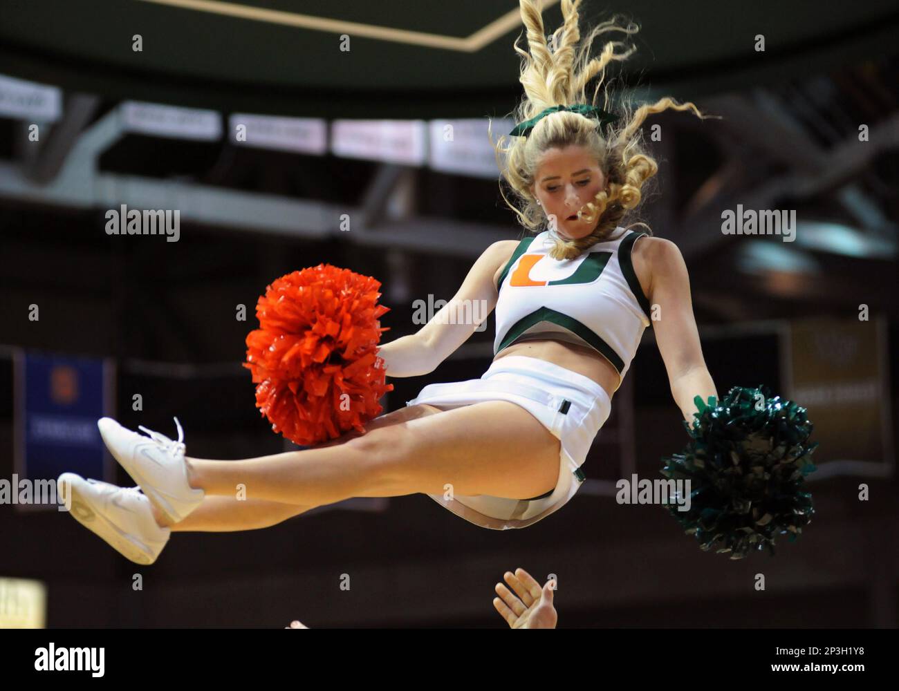 A cheerleaders of the Miami Hurricanes entertains during play against ...
