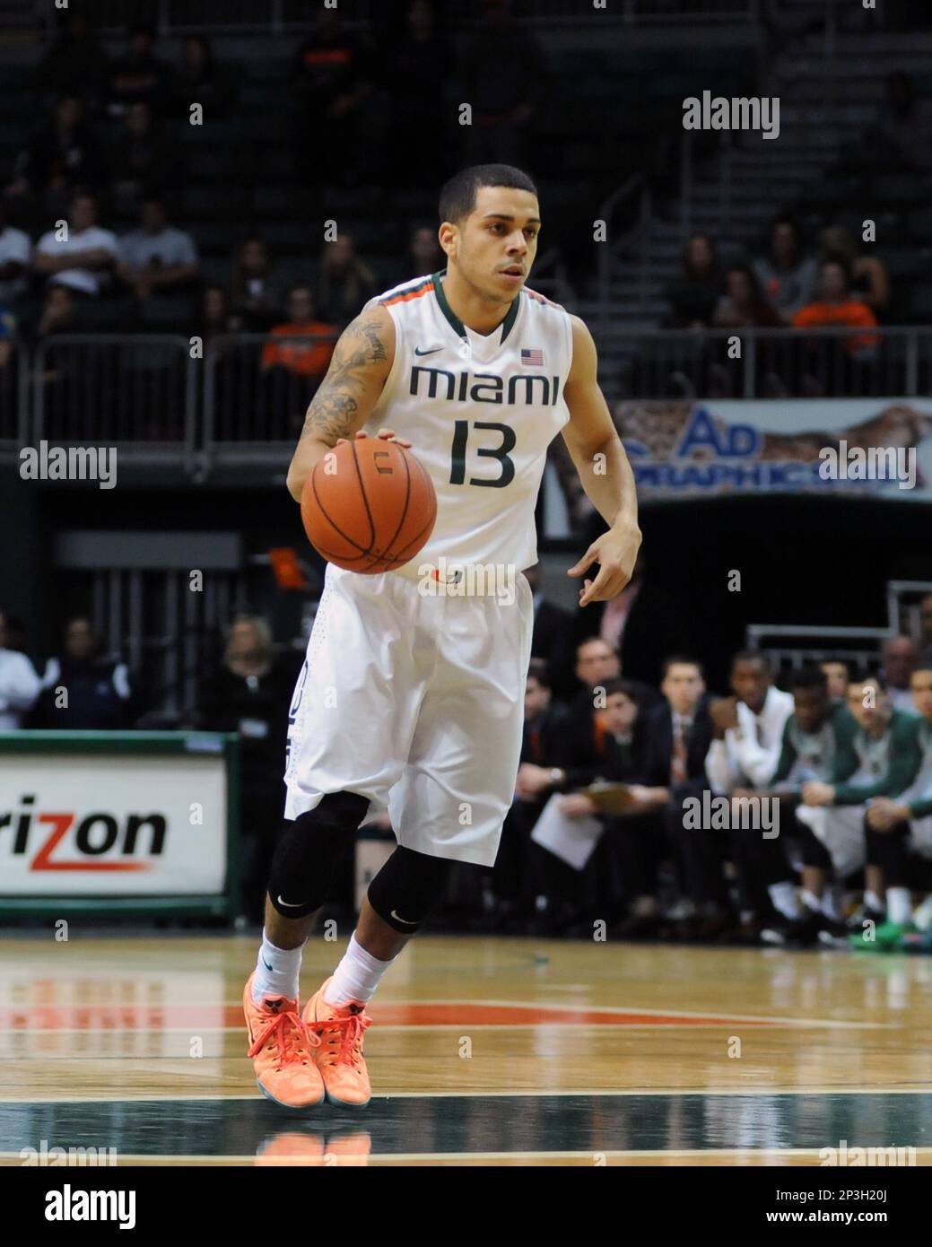 Guard Angel Rodriguez (13) of the Miami Hurricanes looks up court ...