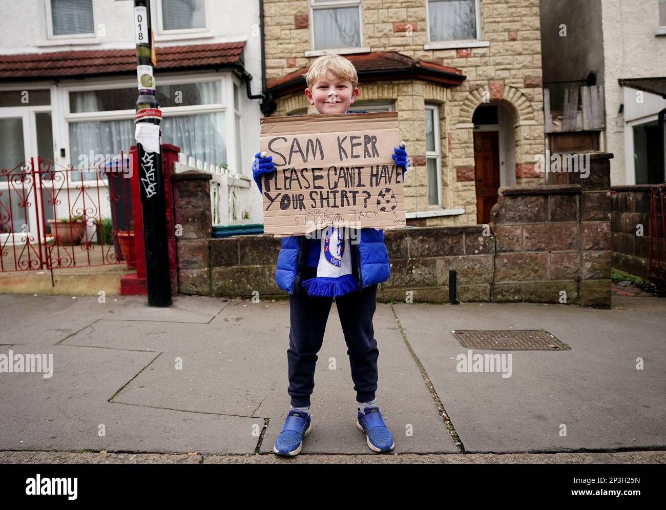 A young Chelsea fan with a sign asking for Sam Kerr's shirt ahead of ...