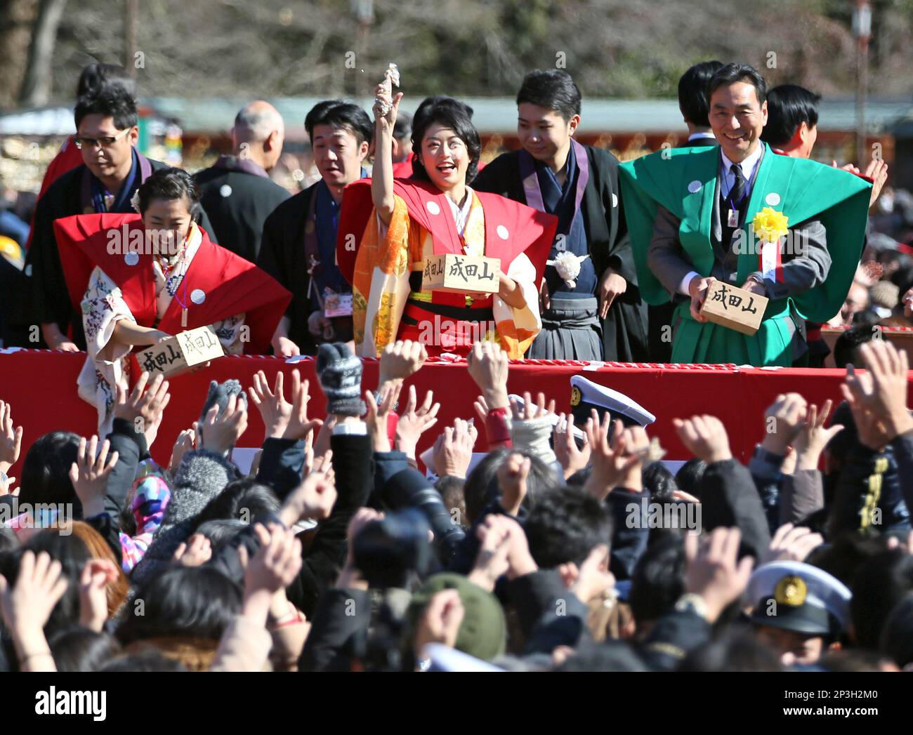(L-R) Actress Yuka, Mao Inoue, and acotor Kyozo Nagatsuka scatter dried ...