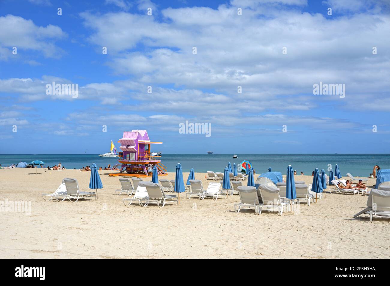 Paradise. Lifeguard Tower and sandy beach with sun loungers and ...