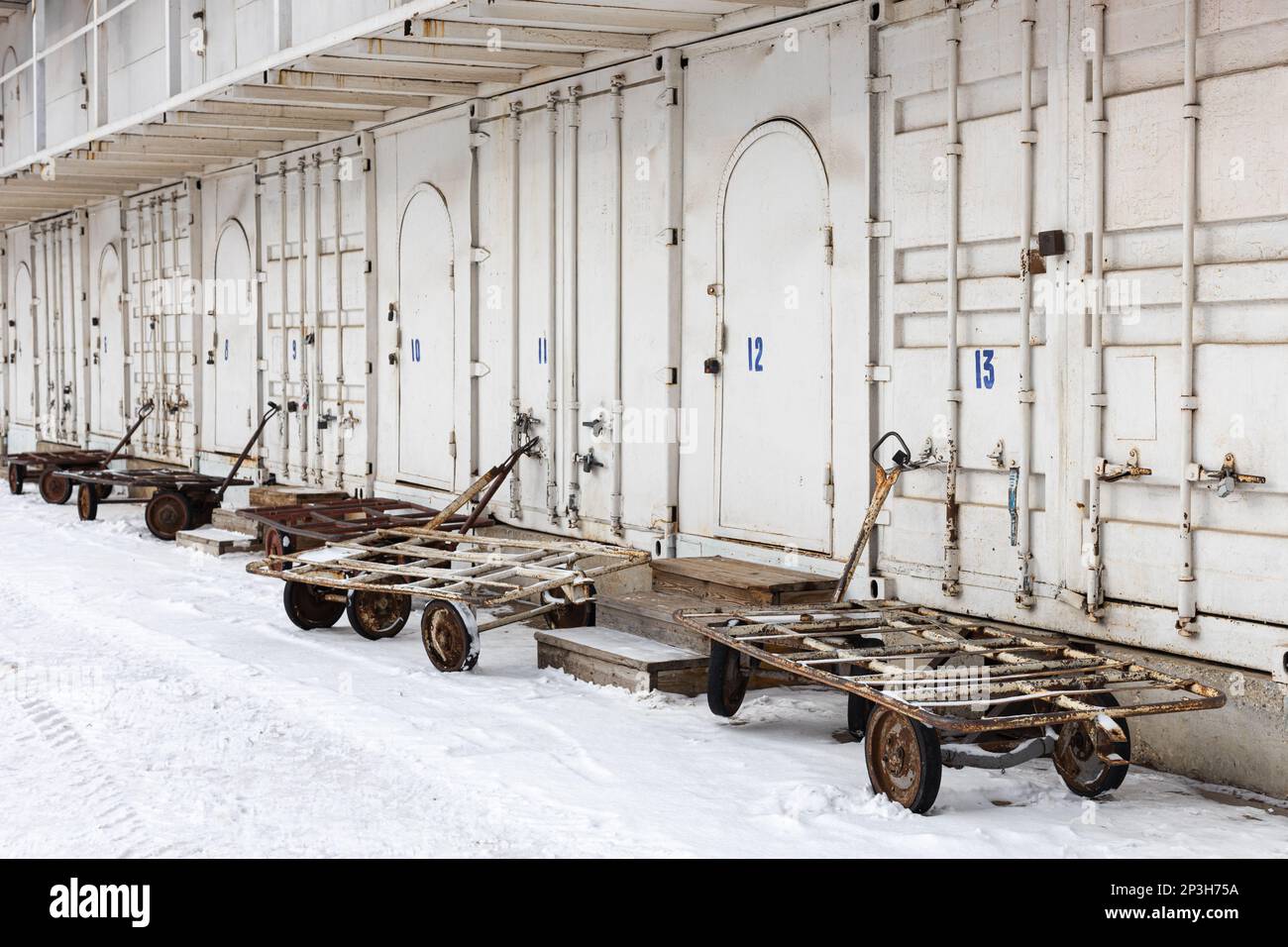 a trolley for transporting goods stands on the street. market container ...
