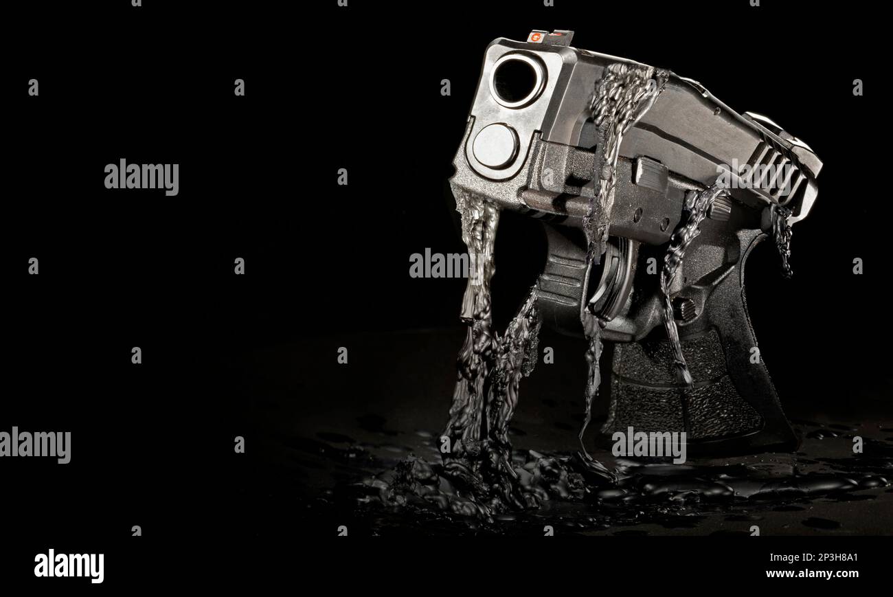 Handgun that seems to be meling on a black background Stock Photo - Alamy