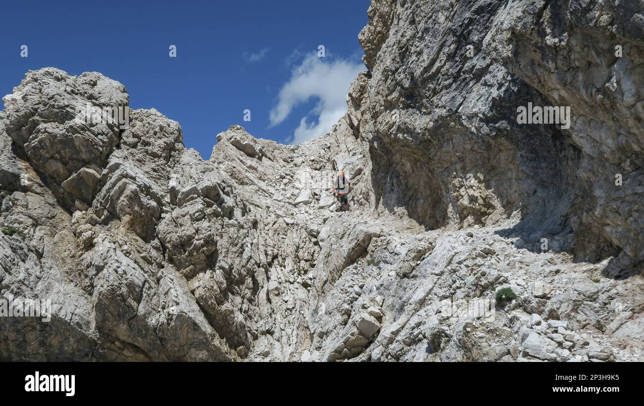Tourist with equipment on the via ferrata trail in the Dolomites Stock ...