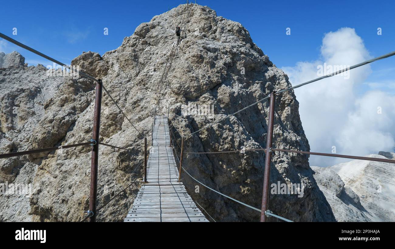 Tourist on the suspension bridge in Monte Cristallo, Dolomite Alps ...
