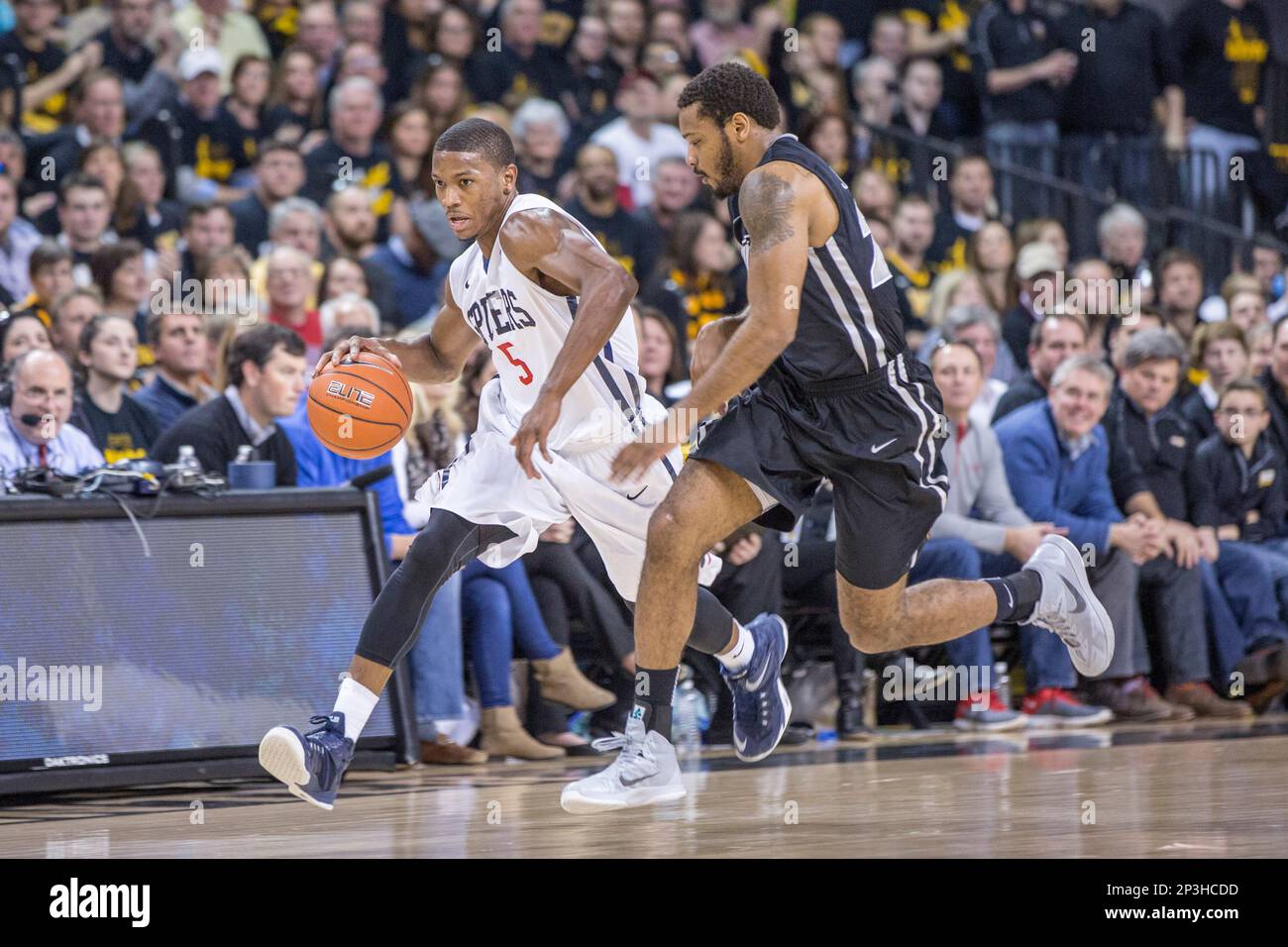 January 31, 2015: #5 Trey Davis driving past #21 Treveon Graham during ...