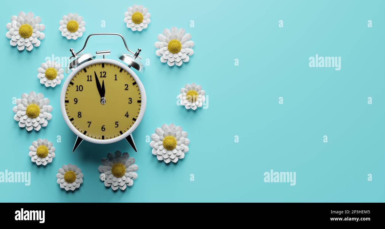 Alarm clock surrounded by flowers. Transitional change of summer time ...