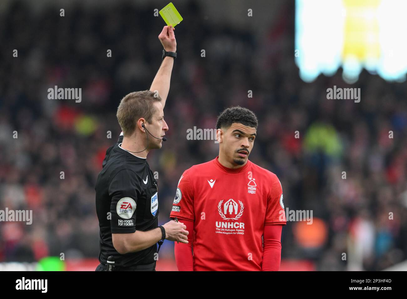 Morgan Gibbs-White #10 of Nottingham Forest receives a yellow card from ...