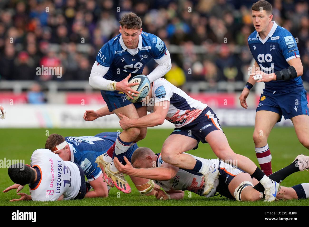 Tom Roebuck #14 of Sale Sharks is tackled during the Gallagher ...