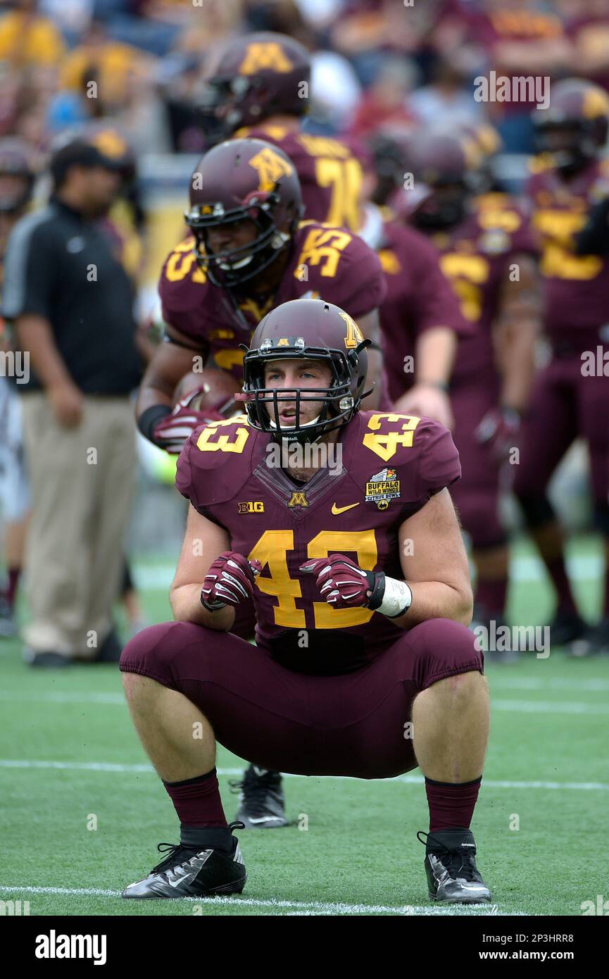 Minnesota fullback Tyler Hartmann (43) warms up before the Citrus Bowl ...