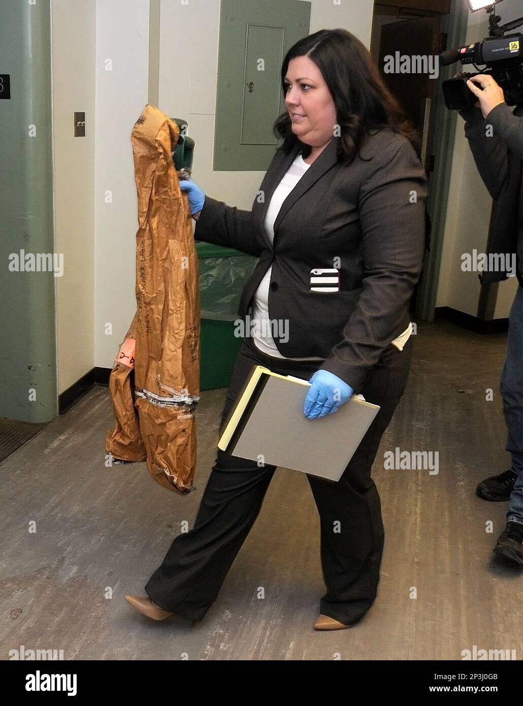 Luzerne County Assistant District Attorney Mamie Phillips carries two ...