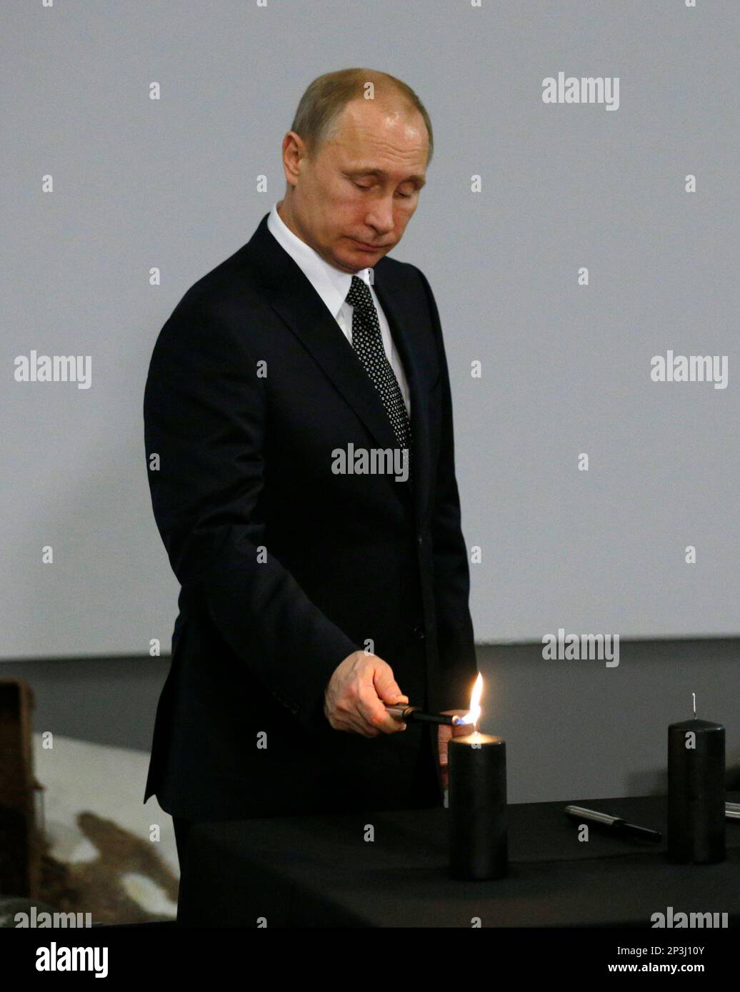 Russian President Vladimir Putin lights a candle at the Jewish Museum ...