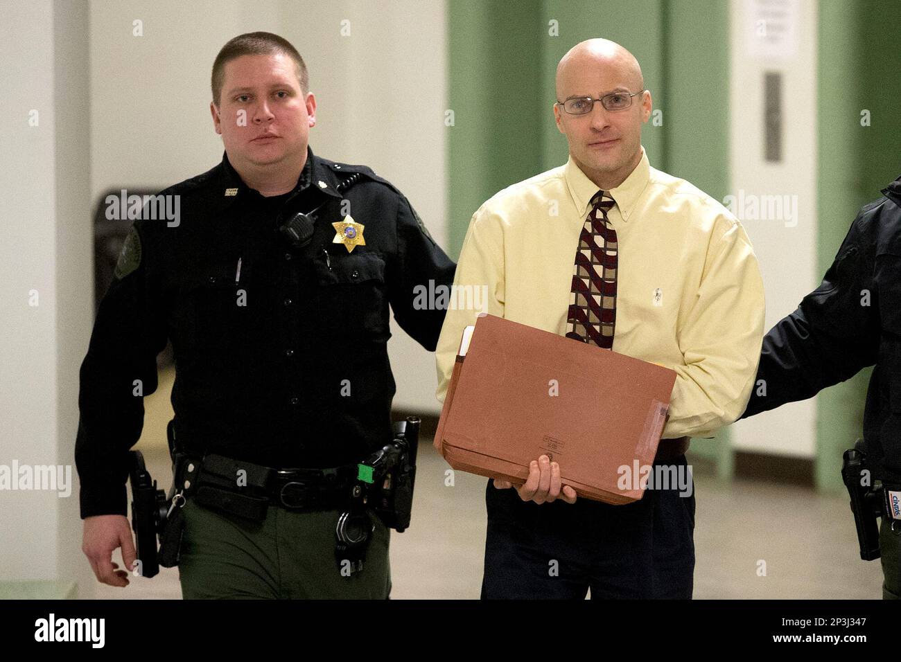 Hugo Selenski, right, is led out of the Luzerne County Courthouse in ...