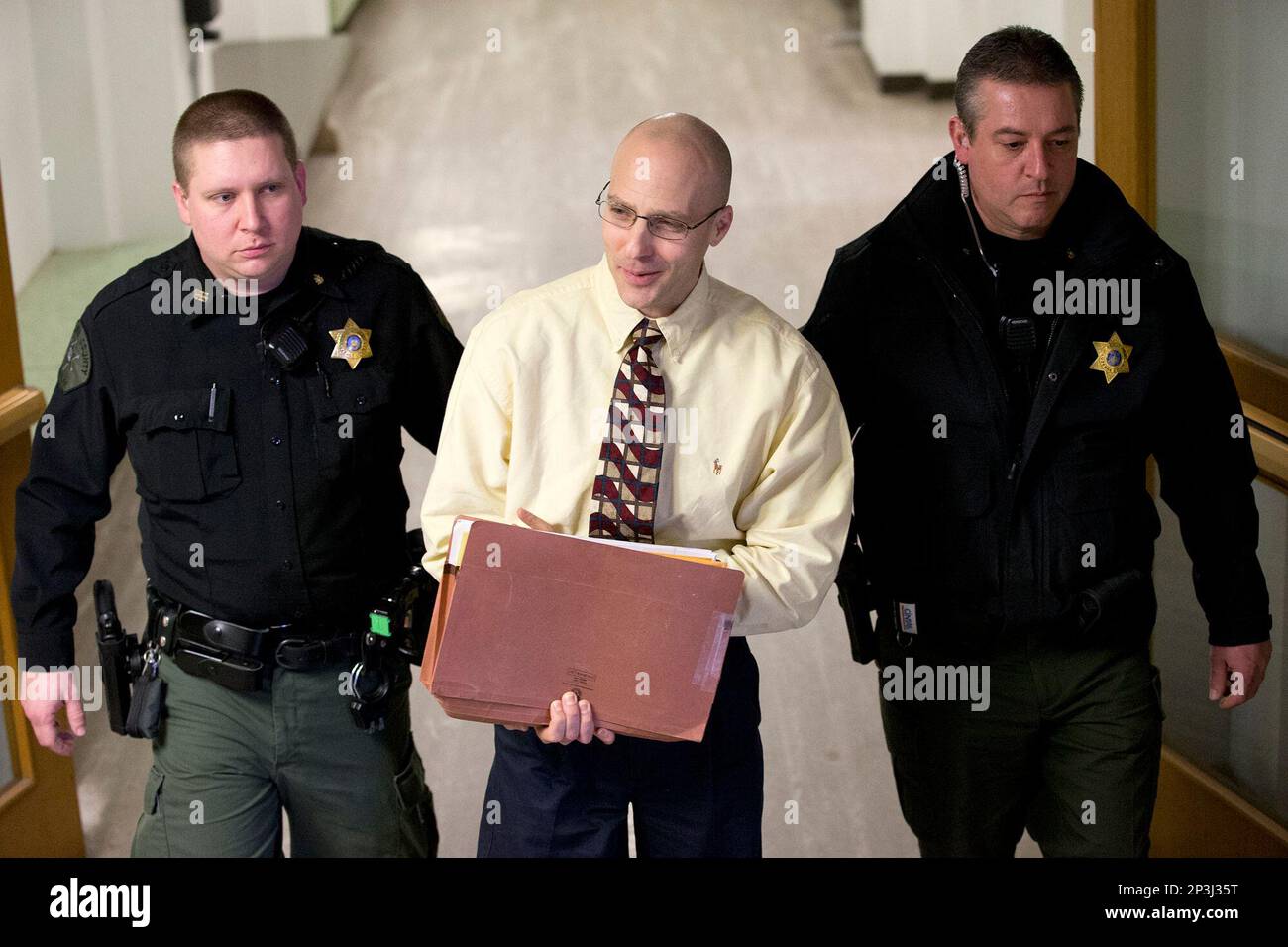 Hugo Selenski, center, is led out of the Luzerne County Courthouse in ...