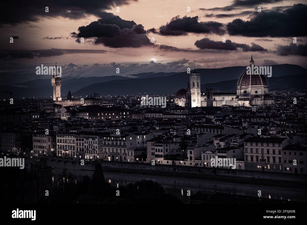 An aerial view of Florence at night with the cathedral towering over ...