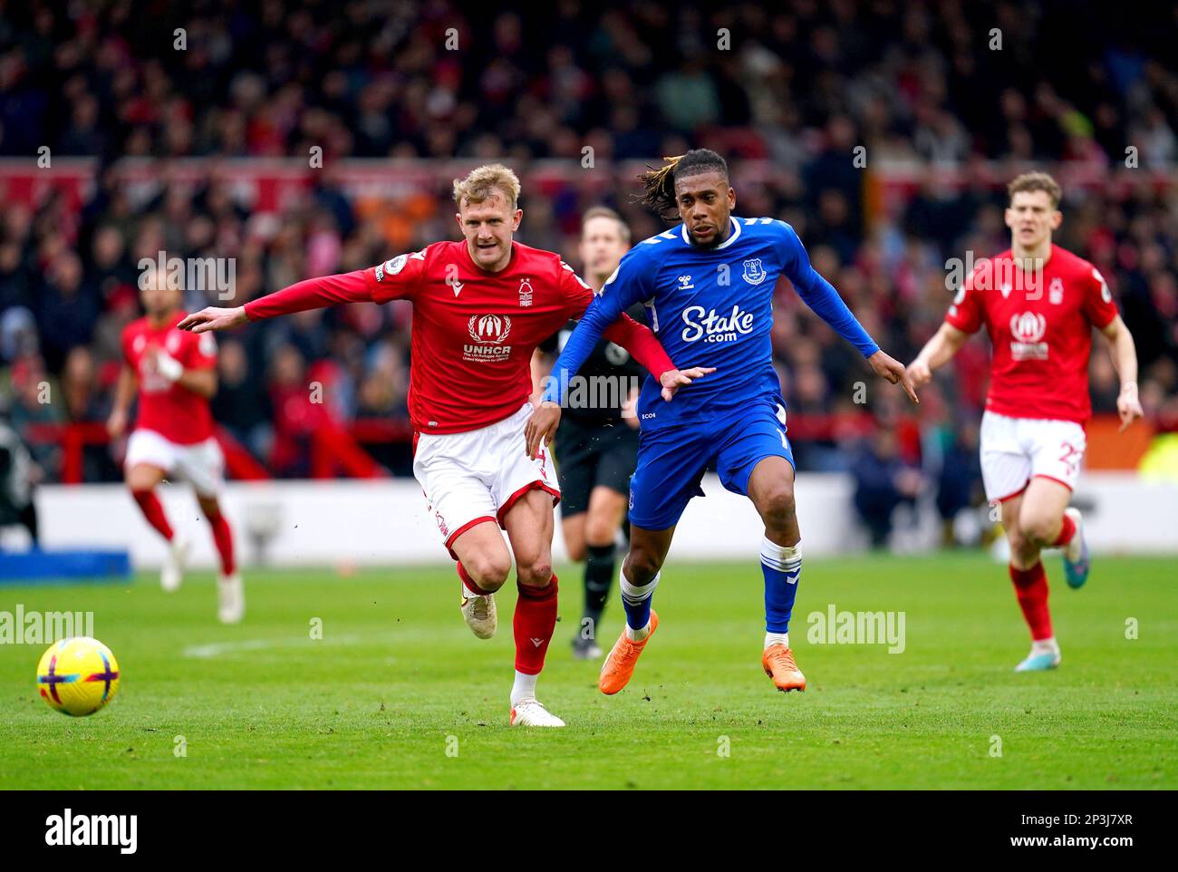Nottingham Forest's Joe Worrall (left) and Everton's Alex Iwobi battle ...