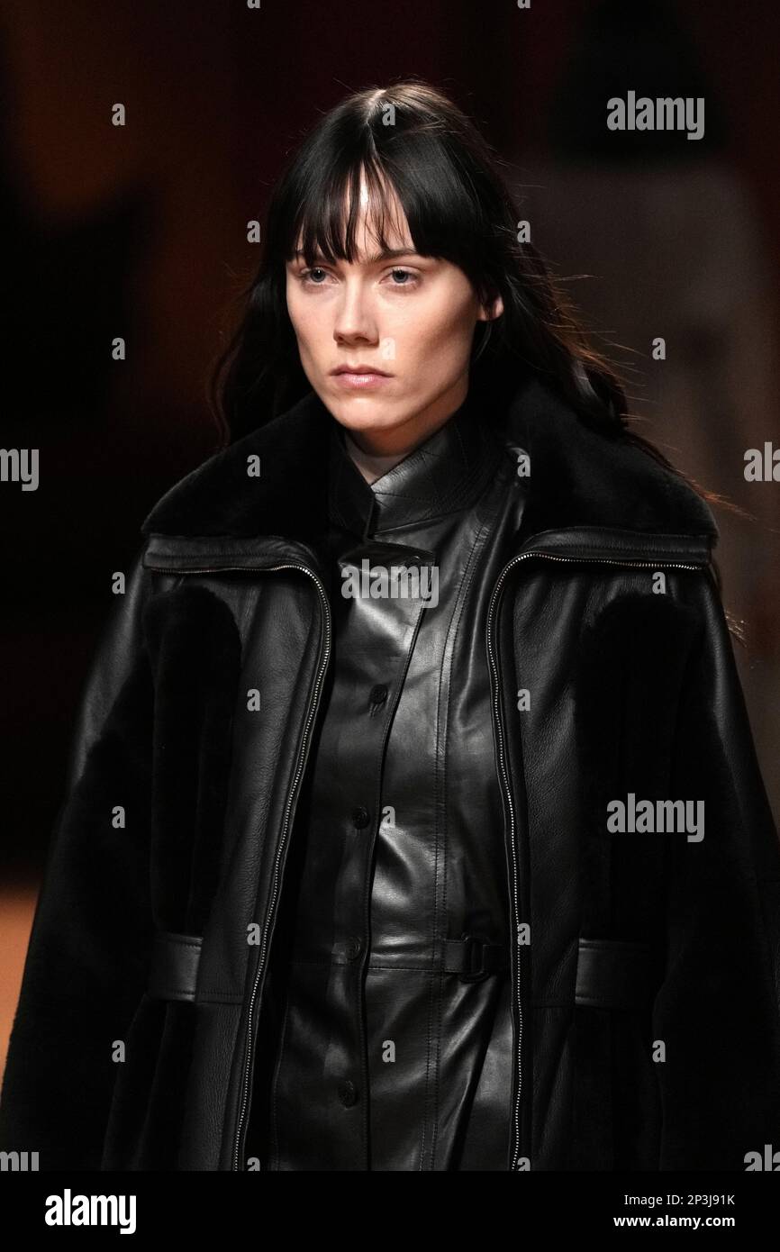 A model wears a creation as part of the Hermes Fall/Winter 2023-2024 ...