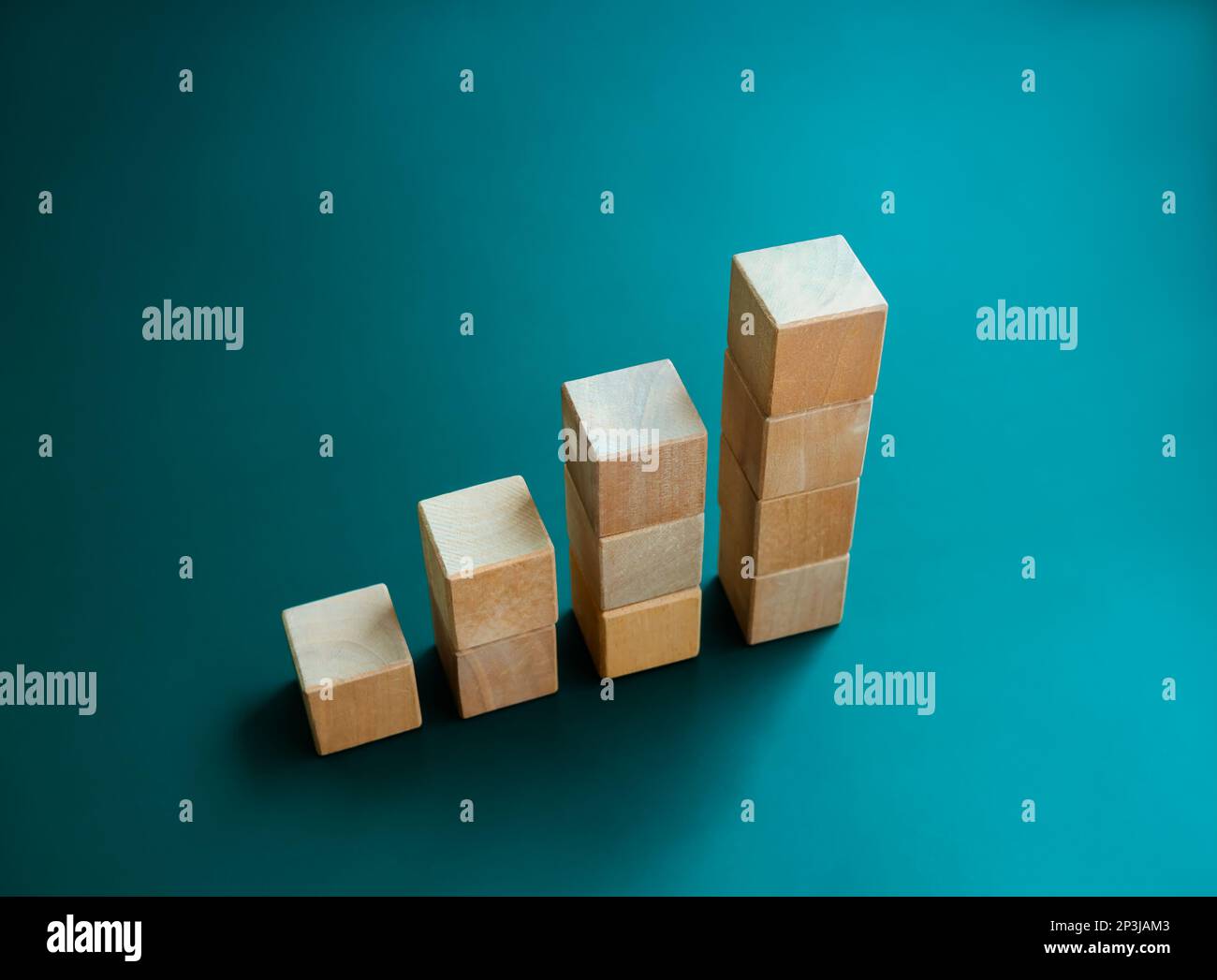 Blank wooden cube blocks bar graph chart steps, isolated on dark blue ...