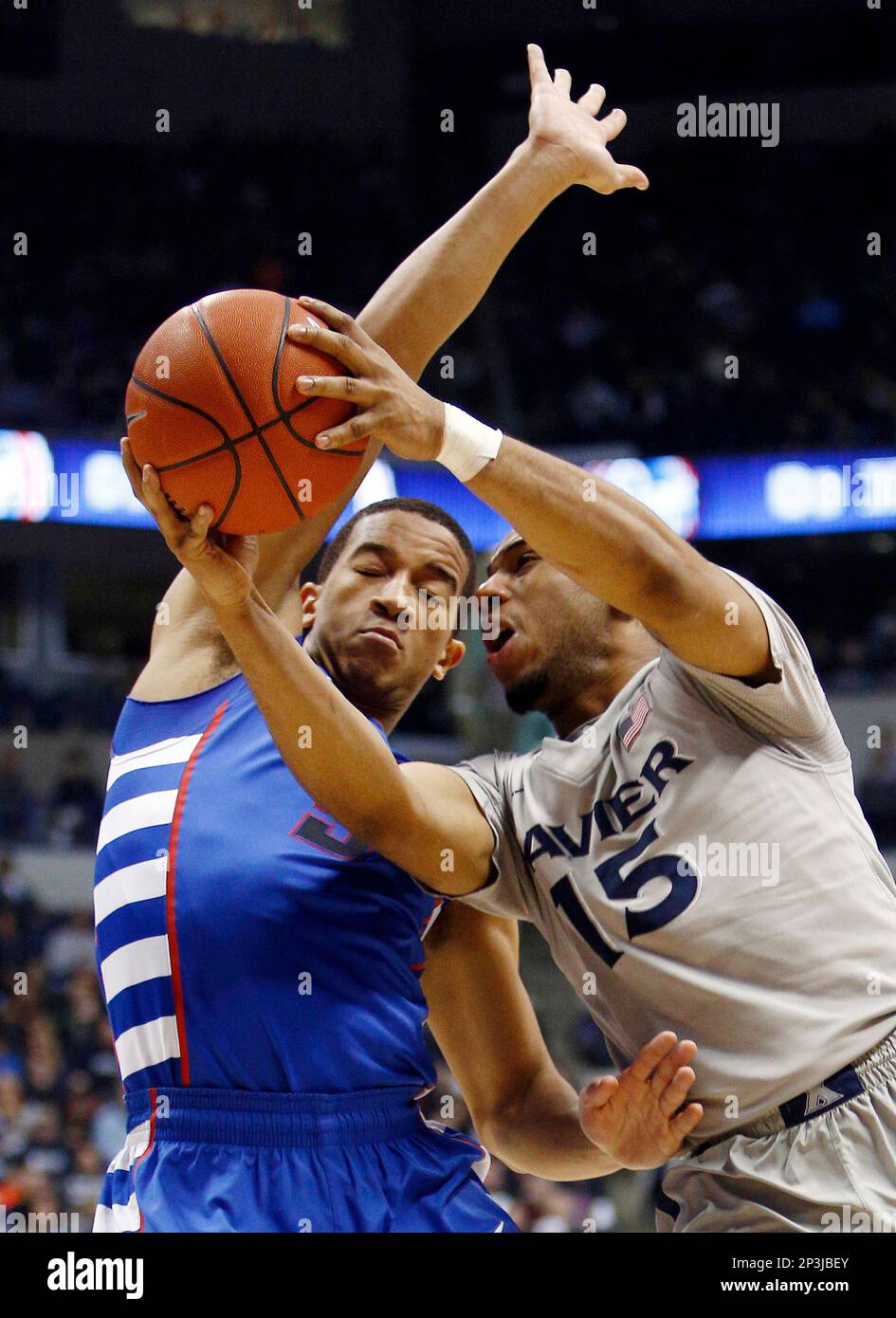 Xavier guard Myles Davis, right, is pressured by DePaul guard Billy ...